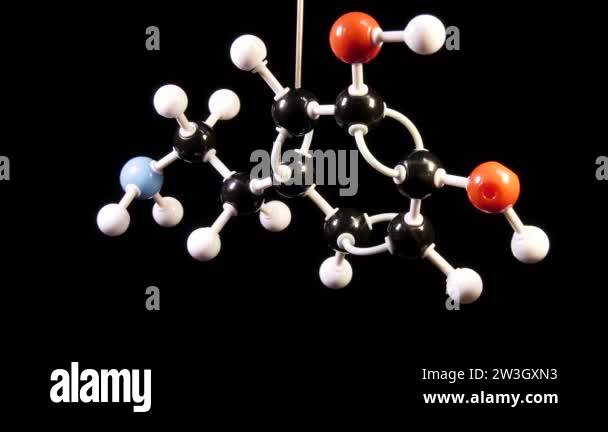 Chemical Formula of a molecule rotating isolated on a black background ...