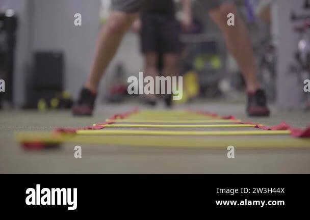 Unrecognizable sportsmen training speed and balance in sports club ...