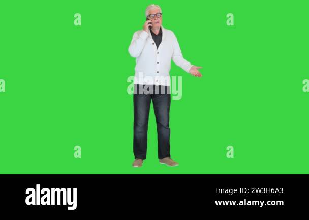 Angry senior man making a call on a Green Screen, Chroma Key Stock ...
