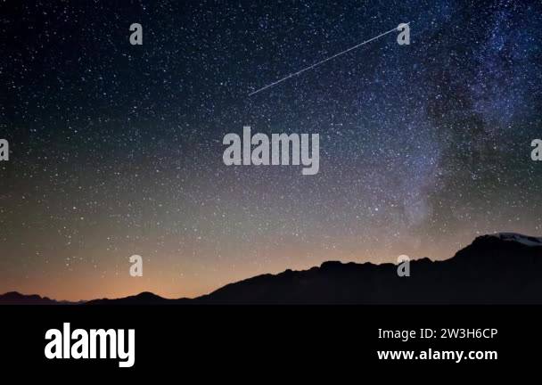 Meteor explosion, meteor shower and stardust smoke trail in night sky ...