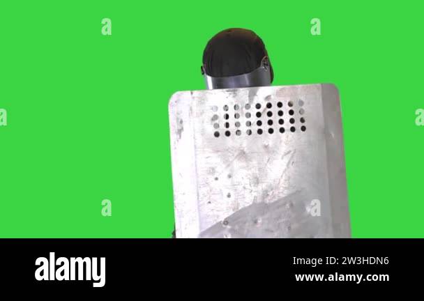 Soldier in full uniform covering with protective shield moving forward ...