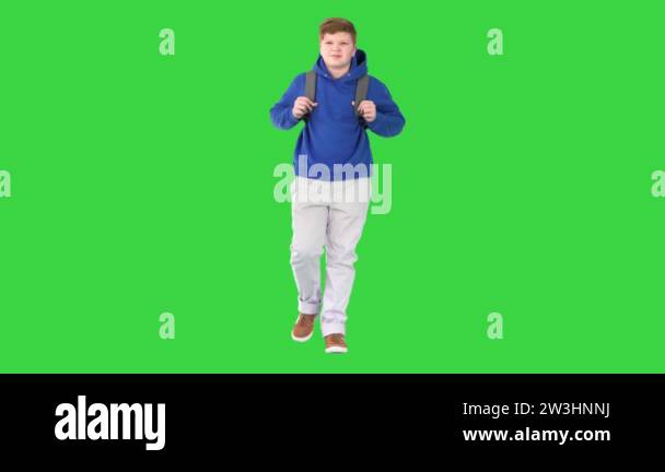 Male student with a backpack walking on a Green Screen, Chroma Key ...