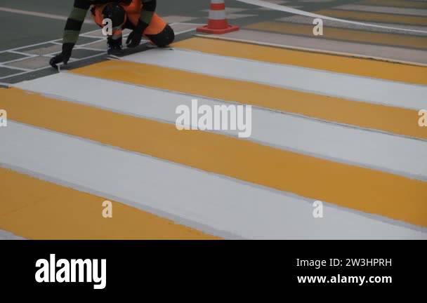 Road markings. Marking of a pedestrian crosswalk on a motorway ...