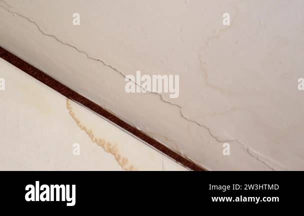 Water cracks on the plaster ceiling after heavy rain or leakage from ...