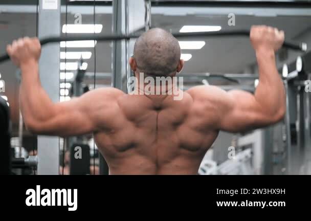 rear view athlete's back slow motion Pull upper block chest sports ...