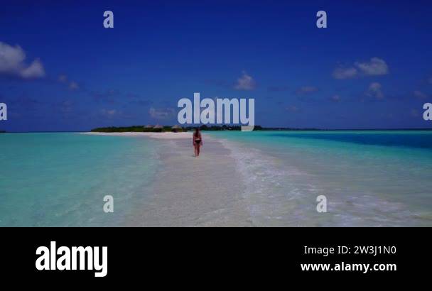 video the tan girl in bikini walking on sea scythe thinking about ...