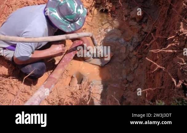 Electric cable repair, open trench with damaged cable on its bottom ...