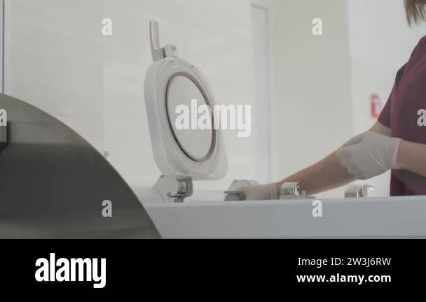 The laboratory assistant makes histological research, microtoming ...