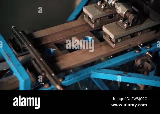 Inserting empty plastic bottle preforms into a conveyor belt Stock ... Inserting empty plastic bottle preforms into a conveyor belt Stock ...
