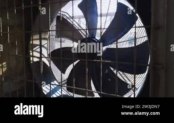 Big industrial fan in a white brick wall of a factory. Ventilation of ...