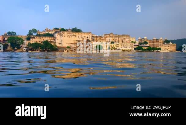 Udaipur City Palace view from lake Pichola. Luxury white palace as an ...