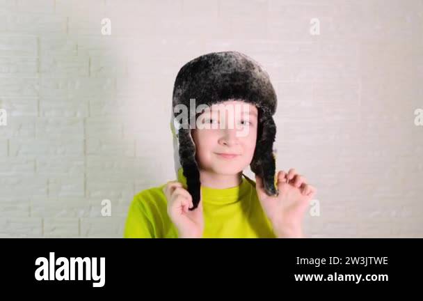 Boy putting on hat head Stock Videos & Footage - HD and 4K Video Clips - Alamy