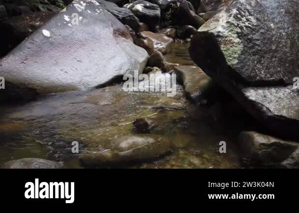 Cinematic shot of the waterfall inside the jungle at the Gunung Gading ...