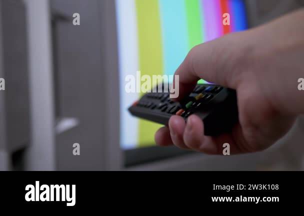 Female Hand Using TV Remote Control Tries a Switch SMPTE Color Bars ...