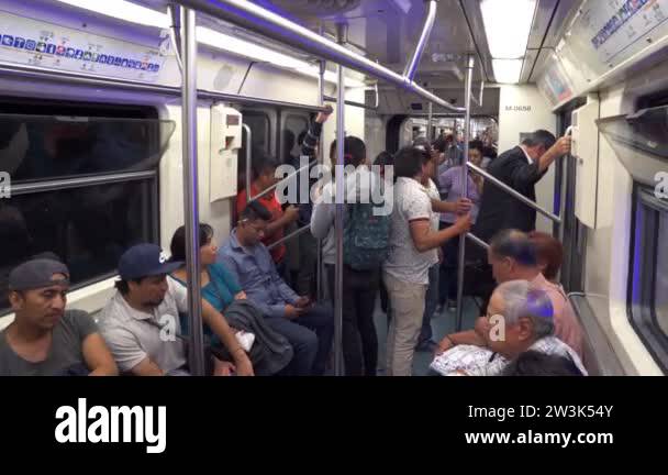 MEXICO CITY, CIRCA 2019. People inside a subway car move to their jobs ...