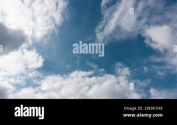 Abstract Building motions clouds. Puffy fluffy white clouds sky time lapse. slow moving clouds ...