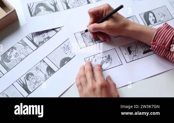 Hands of the artist designer draw a storyboard on paper. Storytelling ...