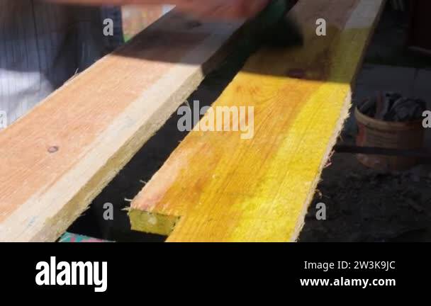 Preparation of boards for construction, men's hands work with wooden ...