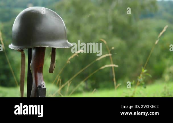 Memorial battlefield cross. Symbol of a fallen US soldier. M1 rifle ...