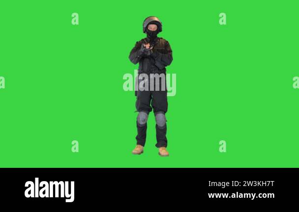 Police tactical unit aiming with a hand gun on a Green Screen, Chroma ...