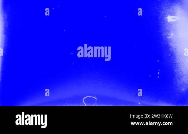 Noisy Old Film Look Overlays Roll Running in Theater projector on Blue ...
