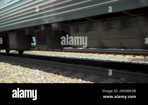Passenger train is passing by. Side view of the wheels. Rail transport ...