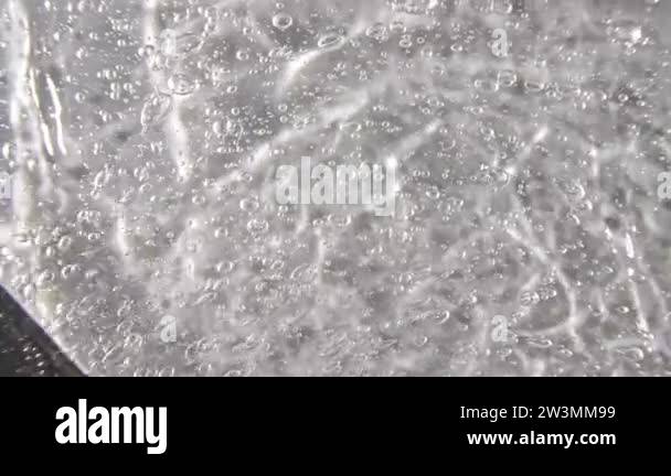 Transparent liquid gel background, clear serum texture. Motion ...