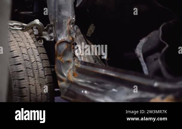 Car mechanic or serviceman check and fix body part for new car at car ...