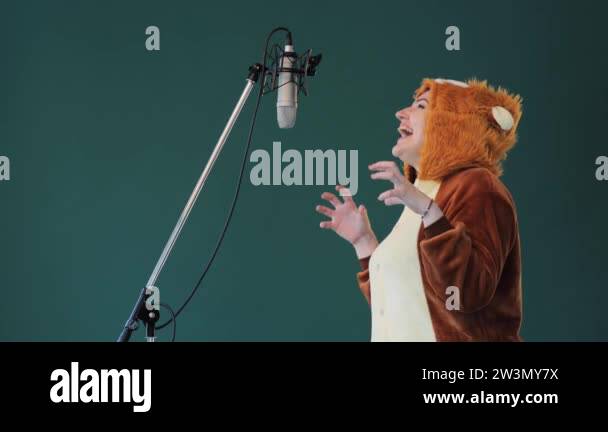 The young adult female with lion costume plays some role during voice ...