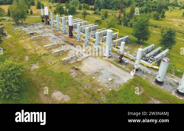 Gas production. Large gas distribution complex. A gas worker or a ...