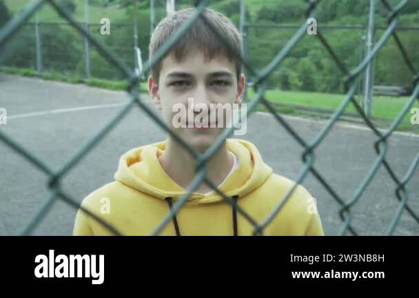 Young man on chain link fence Stock Videos & Footage - HD and 4K Video ...