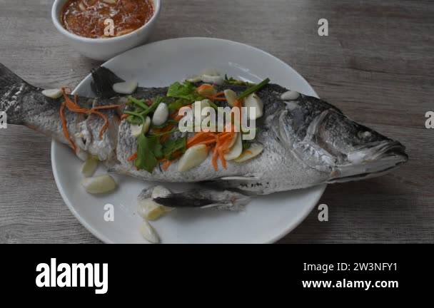 Garlic steamed fish Stock Videos & Footage - HD and 4K Video Clips - Alamy