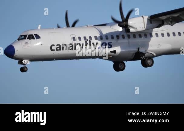 Close up on cockpit fuselage and spinning propellers on turbine engine ...