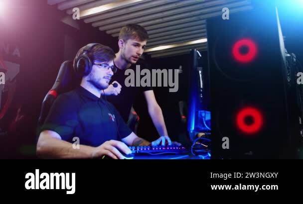 Two gamers playing an online video game and congratulate each other on ...