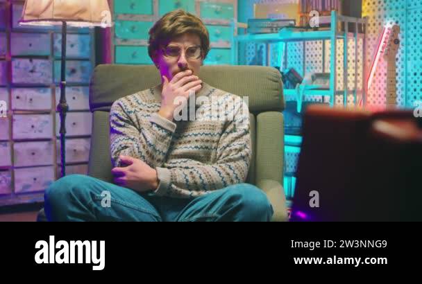 Caucasian funny young man nerd in glasses and with mustache sitting in ...