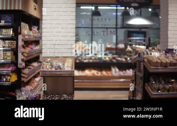 Shopping in the supermarket, side view of the male customer walk ...