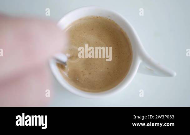 One Person Mixes with a Teaspoon a Cup of Flavored Coffee with Fresh ...