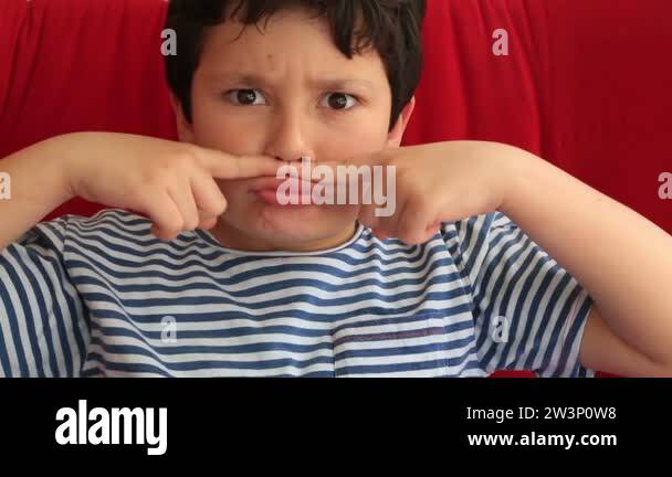 Child making funny silly faces 2 Stock Video Footage - Alamy