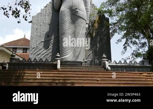 Tilt from the Buddha statue from the Ratnapura temple in Sri Lanka ...