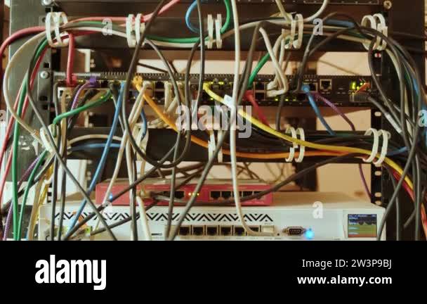 Network switch and ethernet cable in rack cabinet. Network connection ...