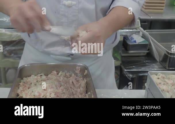 Making Dim Sum. Chef preparing Dim sum dumplings. Kneading the dough ...