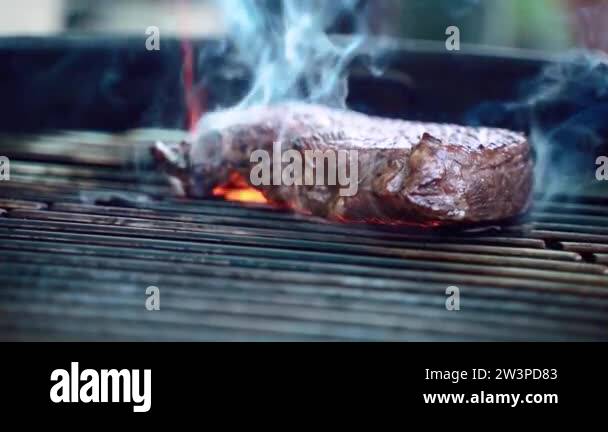 Roasting juicy aged primed rare meat steak in slow motion, grilled beef ...