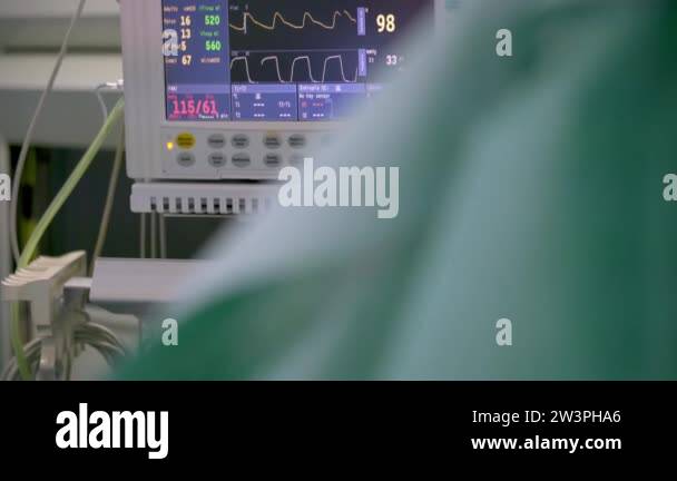 Tilt up view of contemporary monitor shoving sustainable vital signs of ...