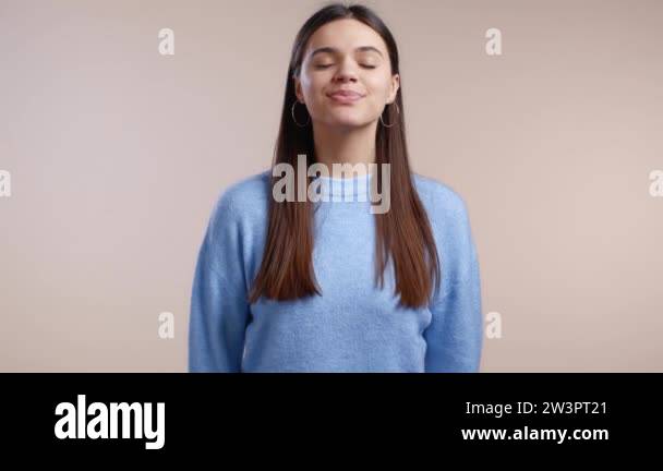 Young woman showing yes sign, nods her head approvingly. Positive ...