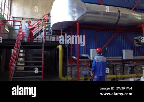 Operators and Manager Working in Central Boiler Plant. District Heating ...