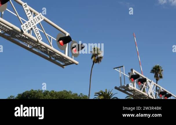Level crossing warning signal in USA. Crossbuck notice and red traffic ...