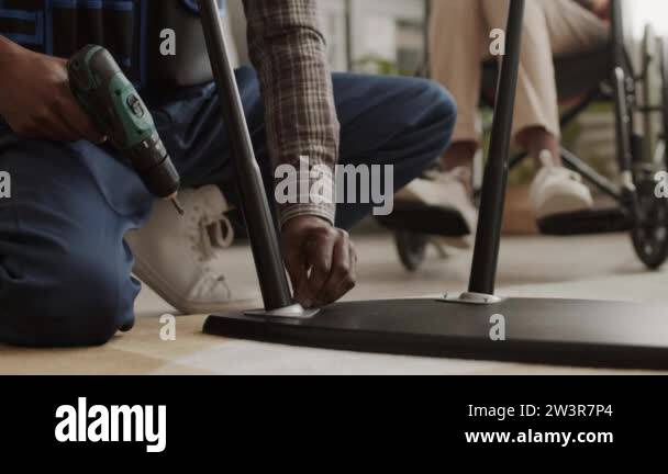 Close up of disabled African person sitting on wheelchair while ...