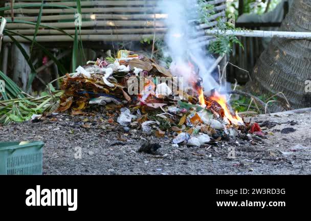 Close up from burning garbage at the beach of Balicasag Island in Bohol ...