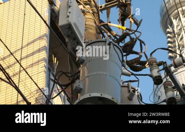 The closer look of the big transformers in the electric post in Tokyo ...