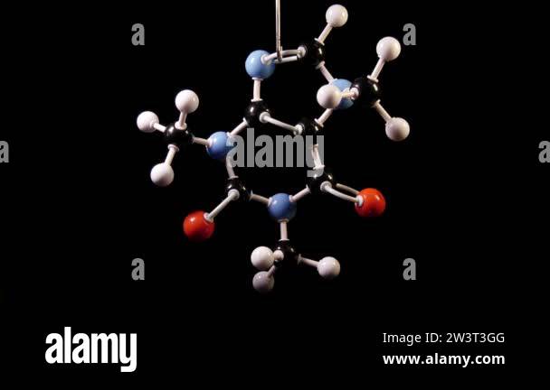Chemical Formula of a molecule rotating isolated on a black background ...